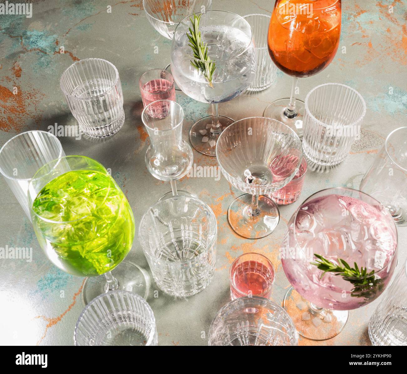 Festive turquoise table with cold exotic alcoholic beverages, cocktails ...