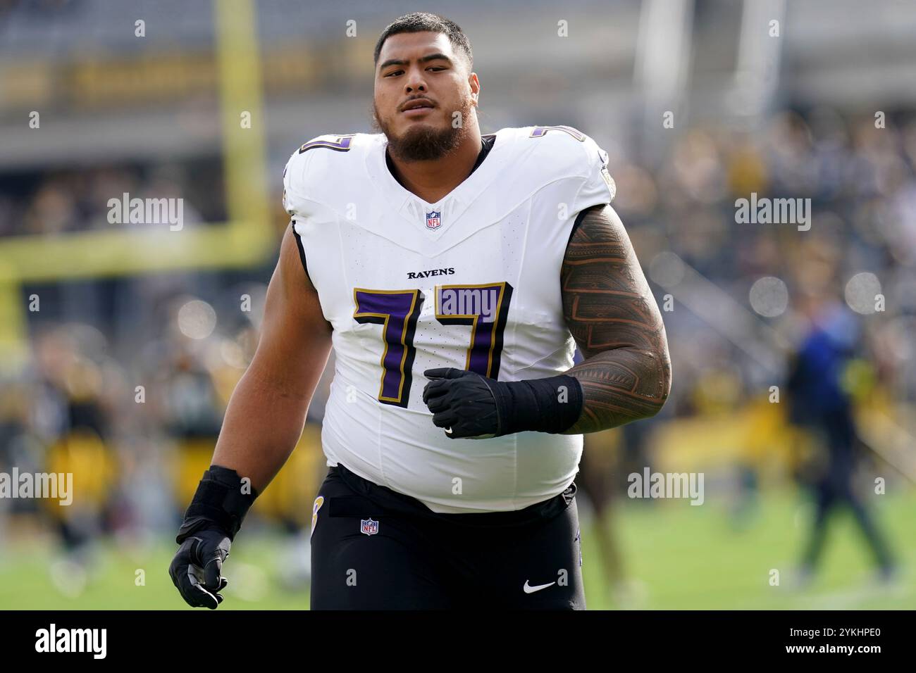 Baltimore Ravens offensive tackle Daniel Faalele (77) warms up before ...