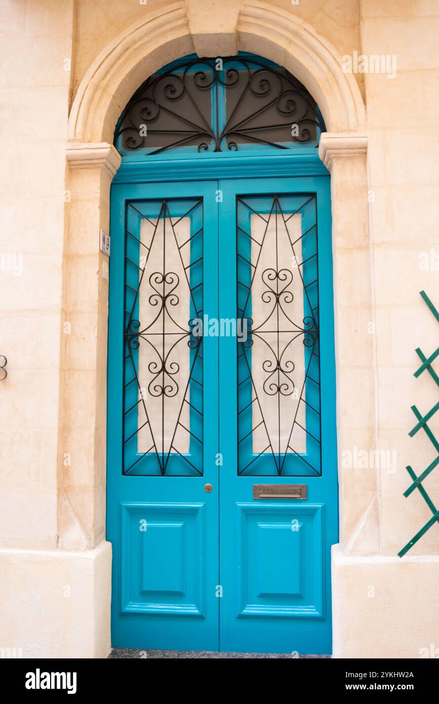 Beautiful traditional entrance door. Blue color with a grid. Malta ...