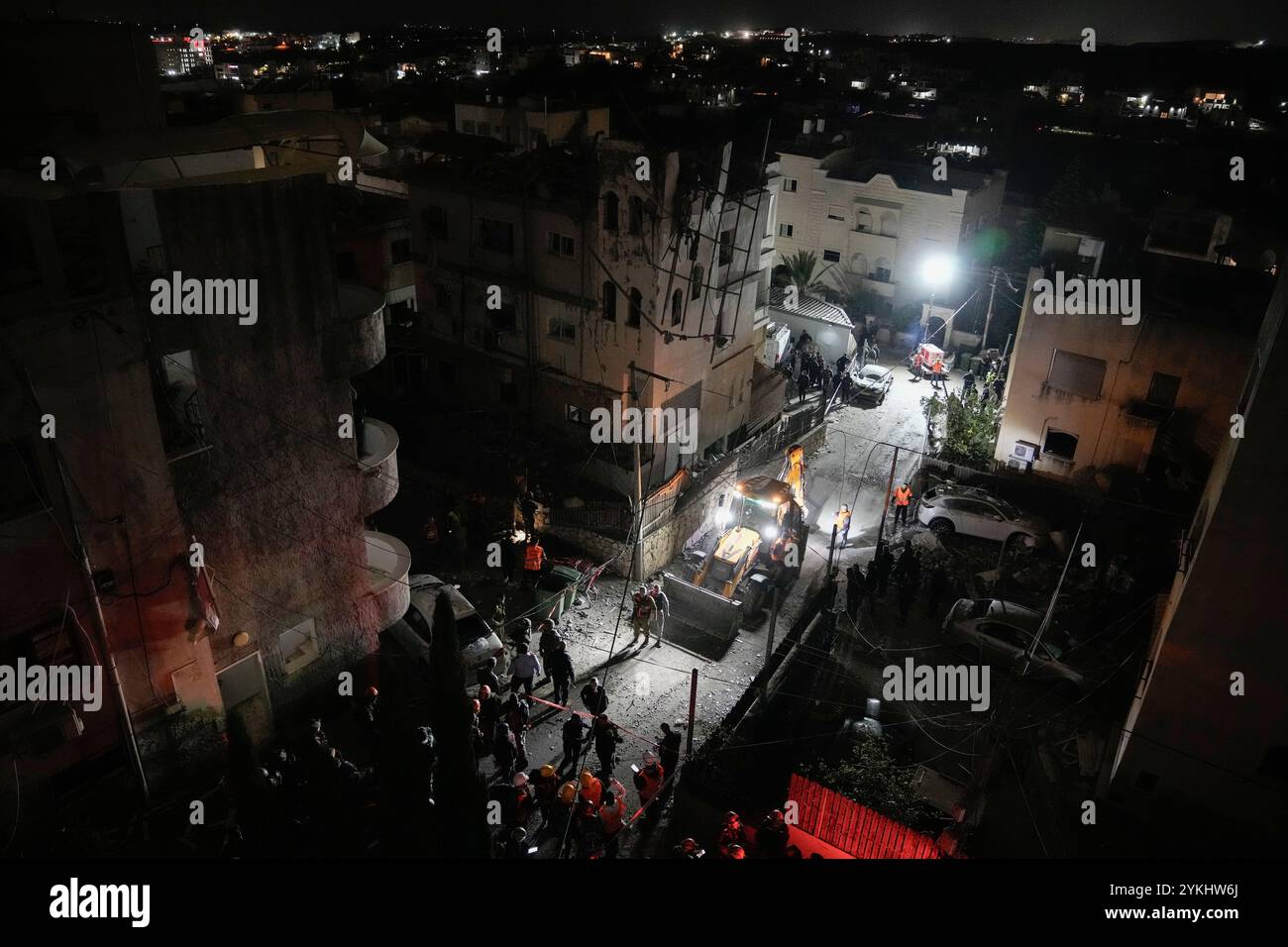 CORRECTS TOWN NAME: Police and rescue workers gather next to a building ... CORRECTS TOWN NAME: Police and rescue workers gather next to a building ...