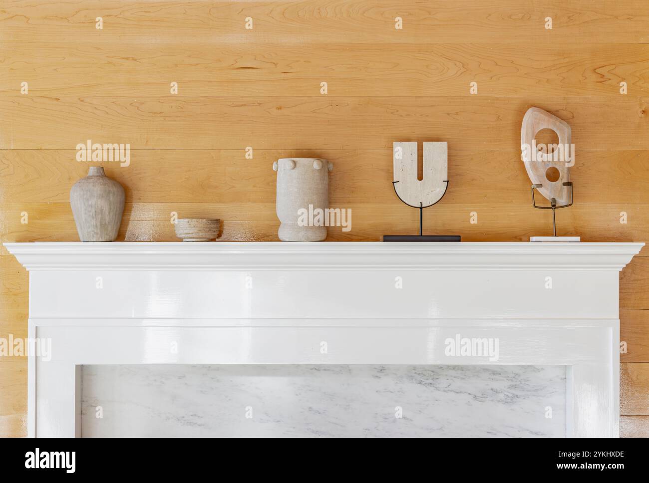 five pieces of art on a white mantle Stock Photo - Alamy