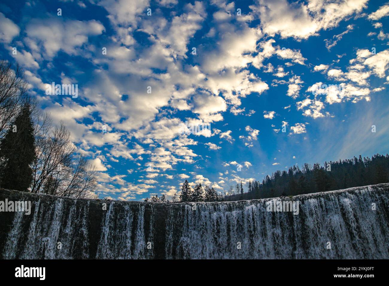 High water level on the Vistula River, water falling from the waterfall ...