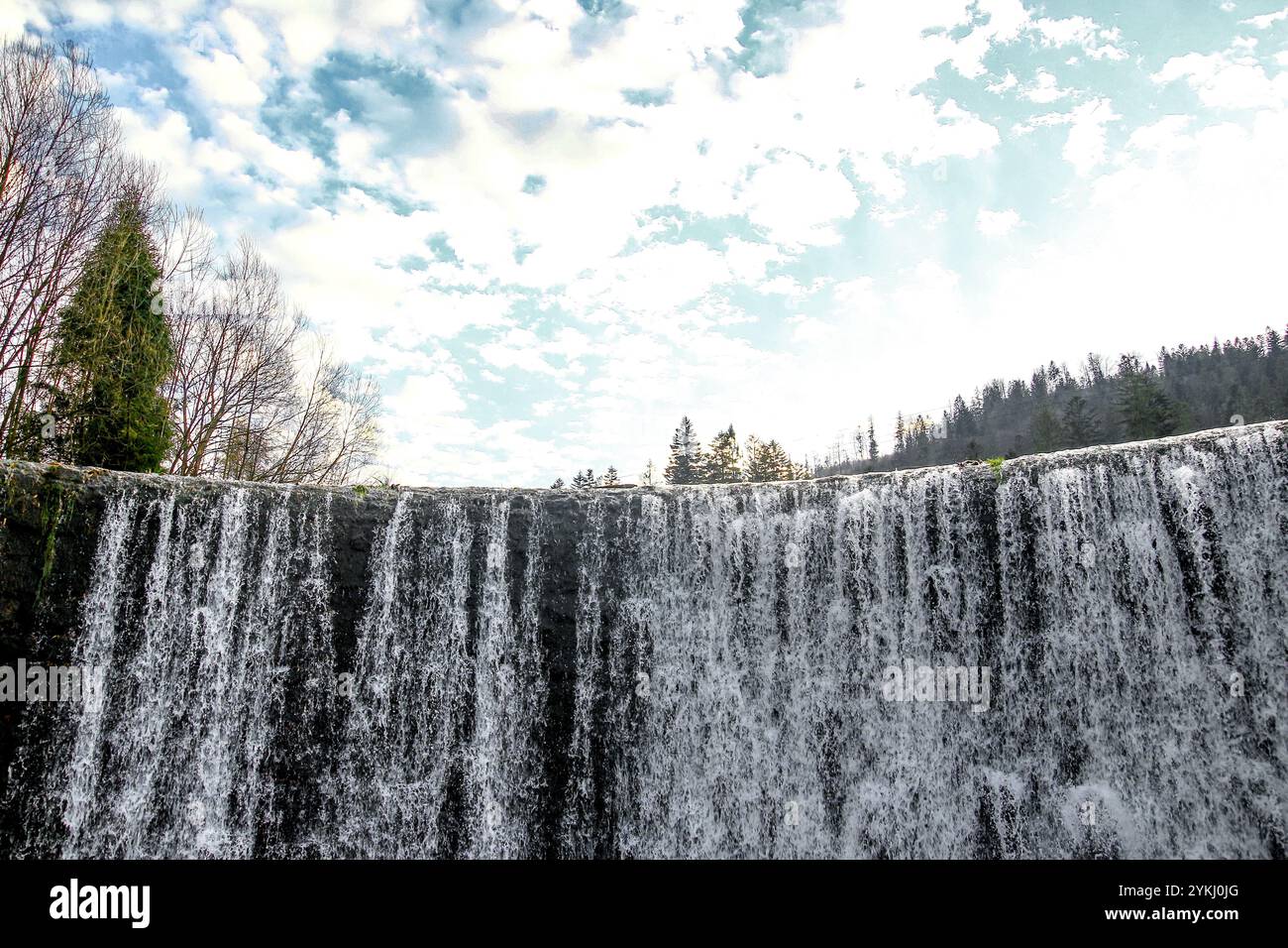 High water level on the Vistula River, water falling from the waterfall ...