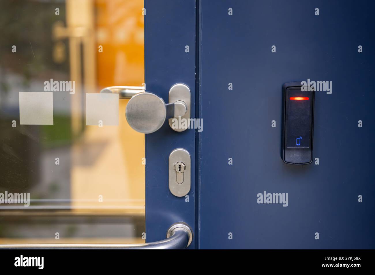 Close up view of door with electric lock with reader of entry system ...
