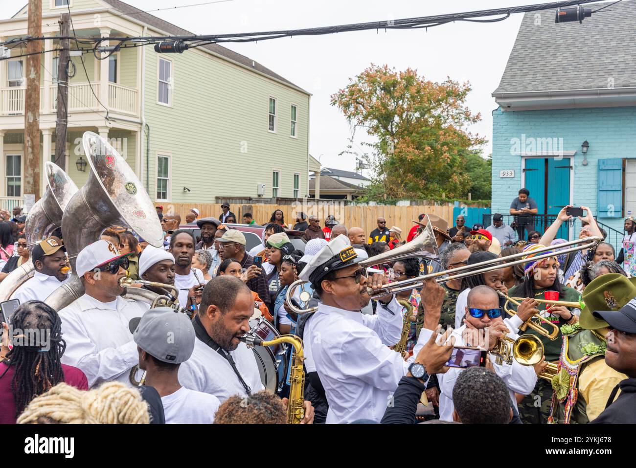A Second Line parade moving through the streets of the Treme ...