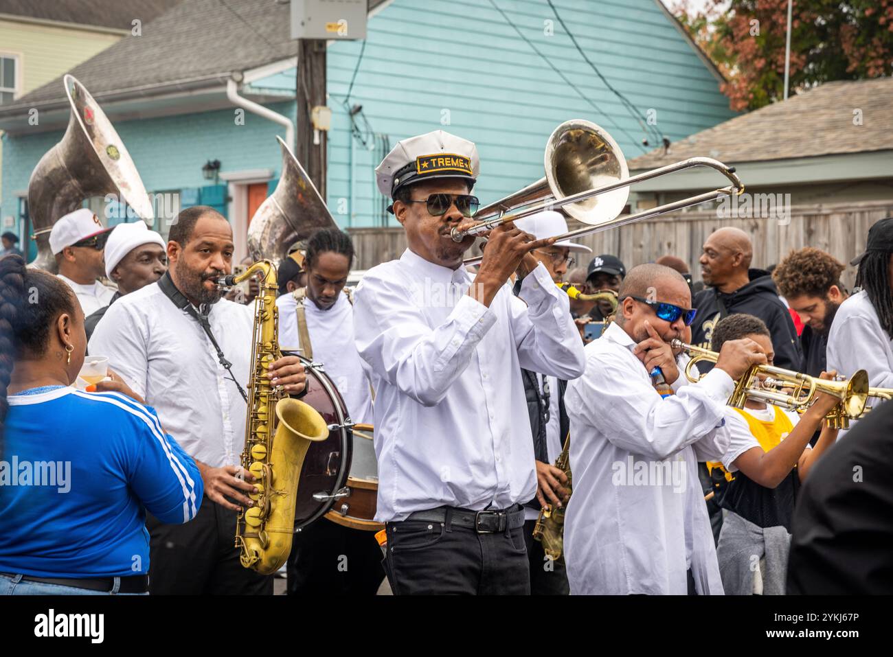 A Second Line parade moving through the streets of the Treme ...