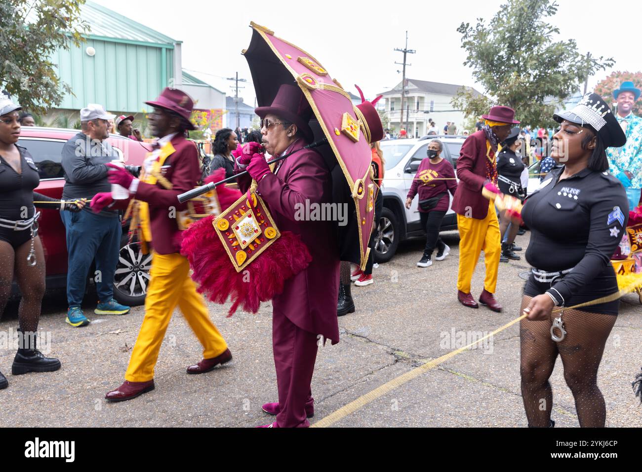 A Second Line parade moving through the streets of the Treme ...
