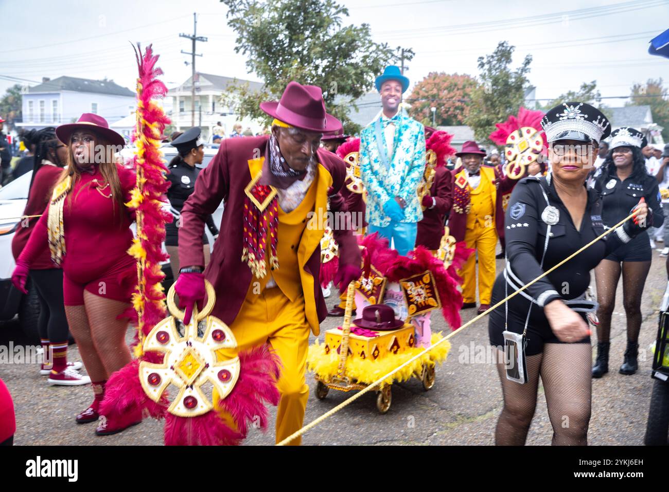 A Second Line parade moving through the streets of the Treme ...