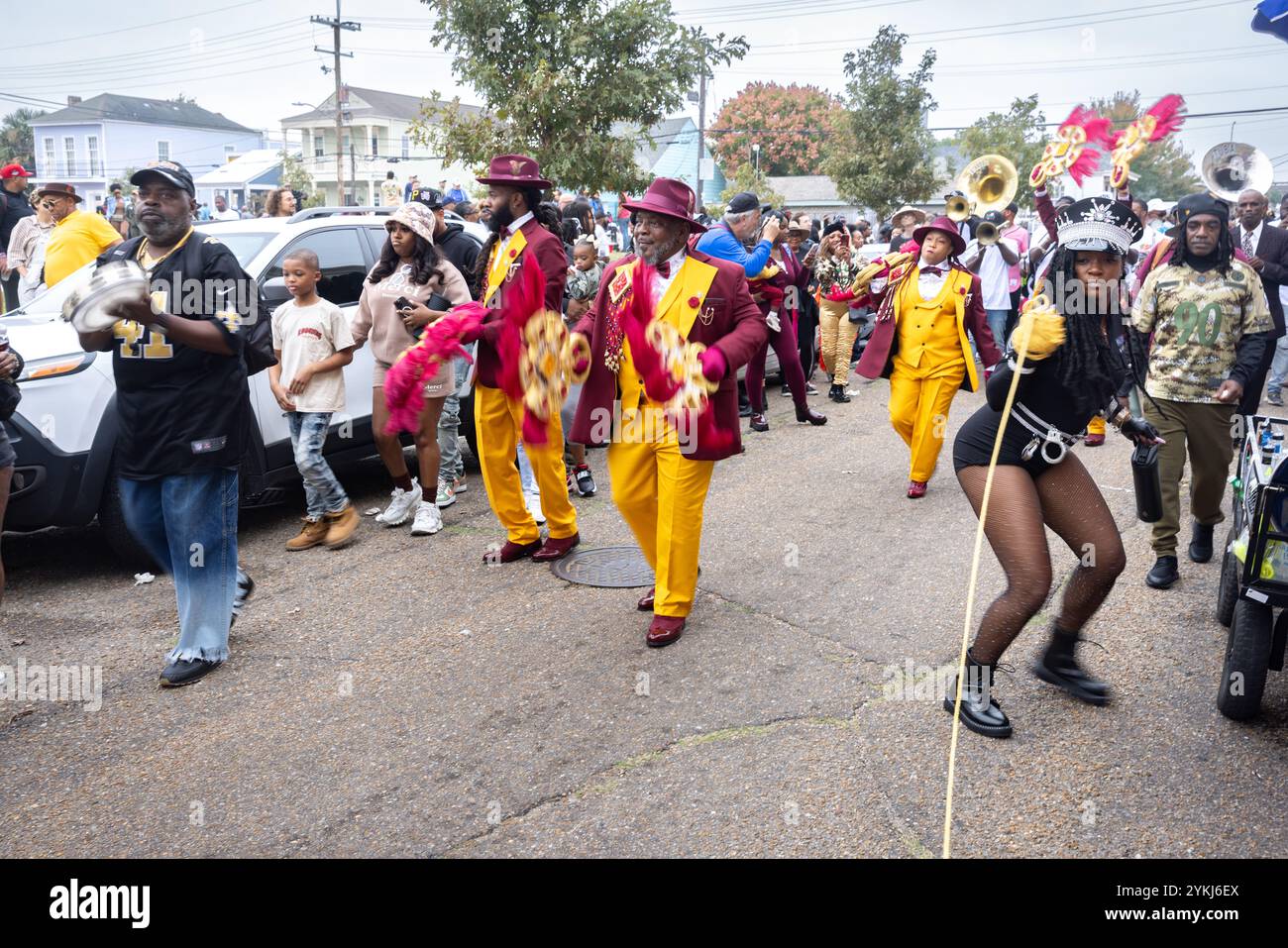 A Second Line parade moving through the streets of the Treme ...