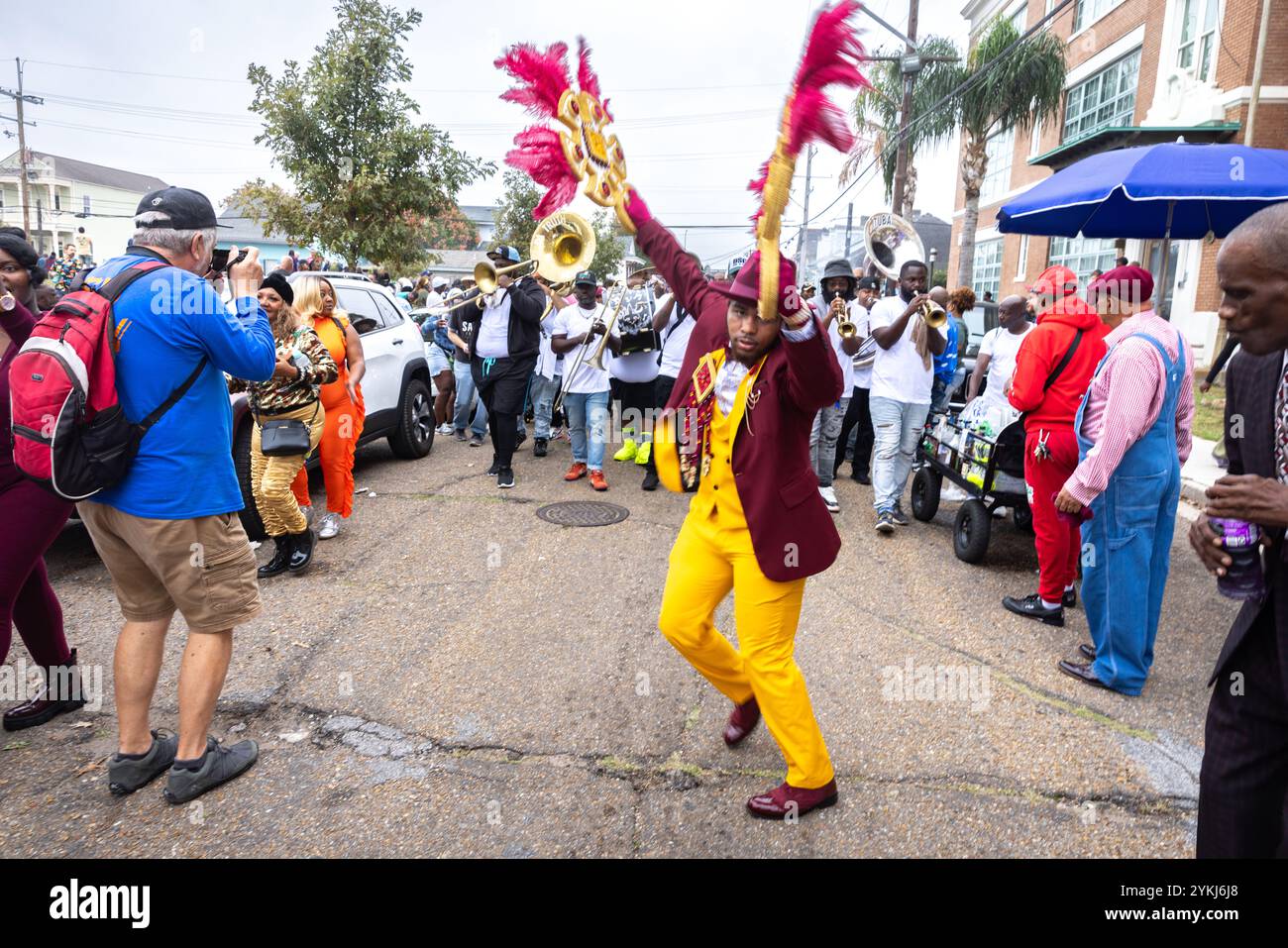 A Second Line parade moving through the streets of the Treme ...