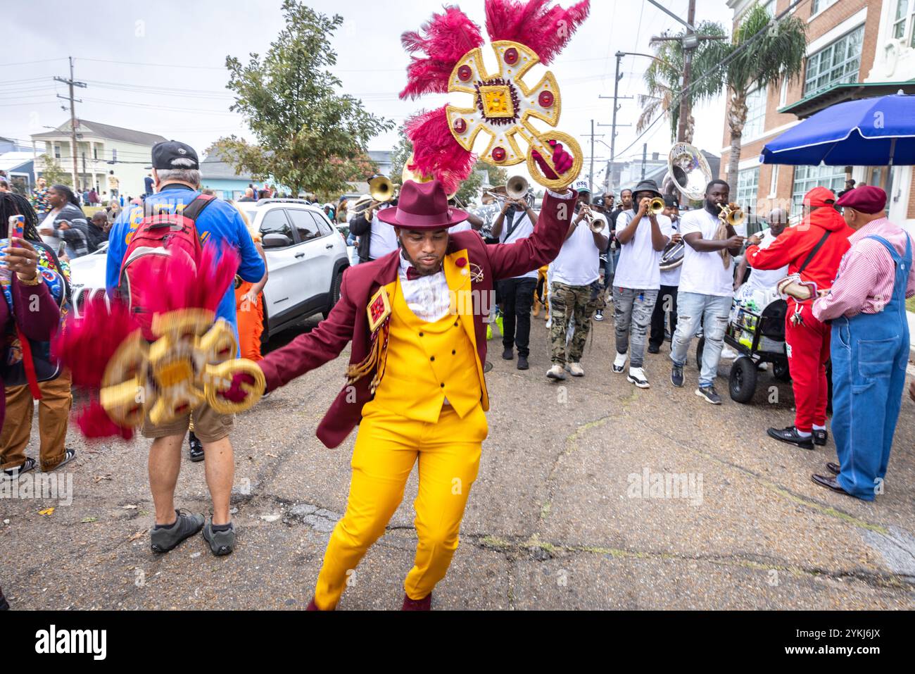 A Second Line parade moving through the streets of the Treme ...