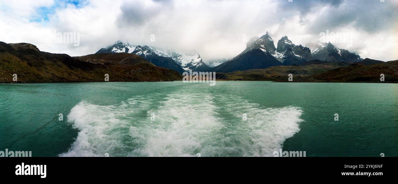 Panoramic image of mountain range overlooking lago pehoe, Torres Del Paine, National Park, Chile ...