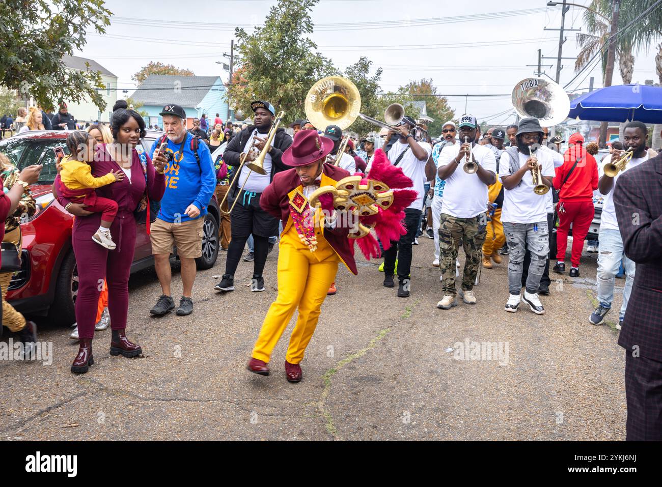 A Second Line parade moving through the streets of the Treme ...