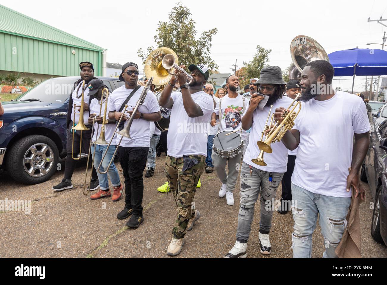 A Second Line parade moving through the streets of the Treme ...
