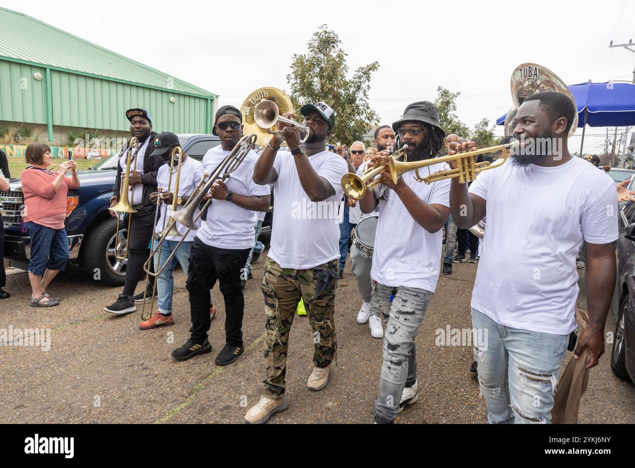 A Second Line parade moving through the streets of the Treme ...