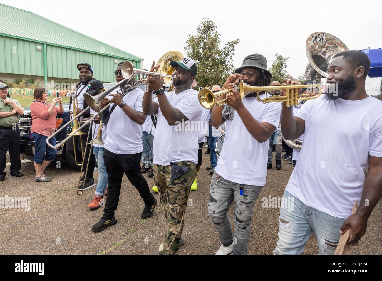 A Second Line parade moving through the streets of the Treme ...