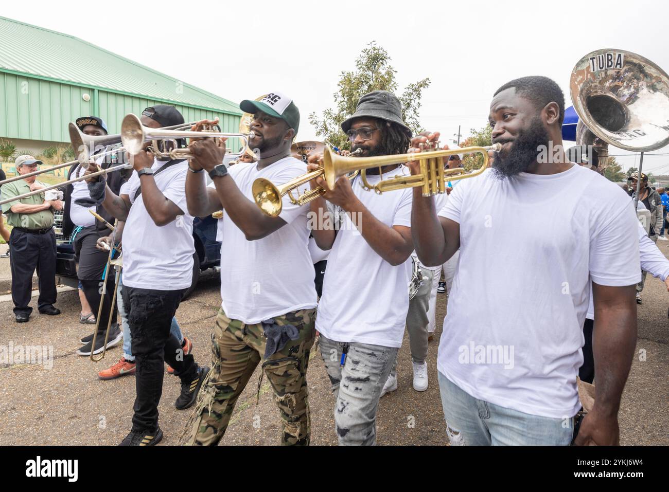 A Second Line parade moving through the streets of the Treme ...