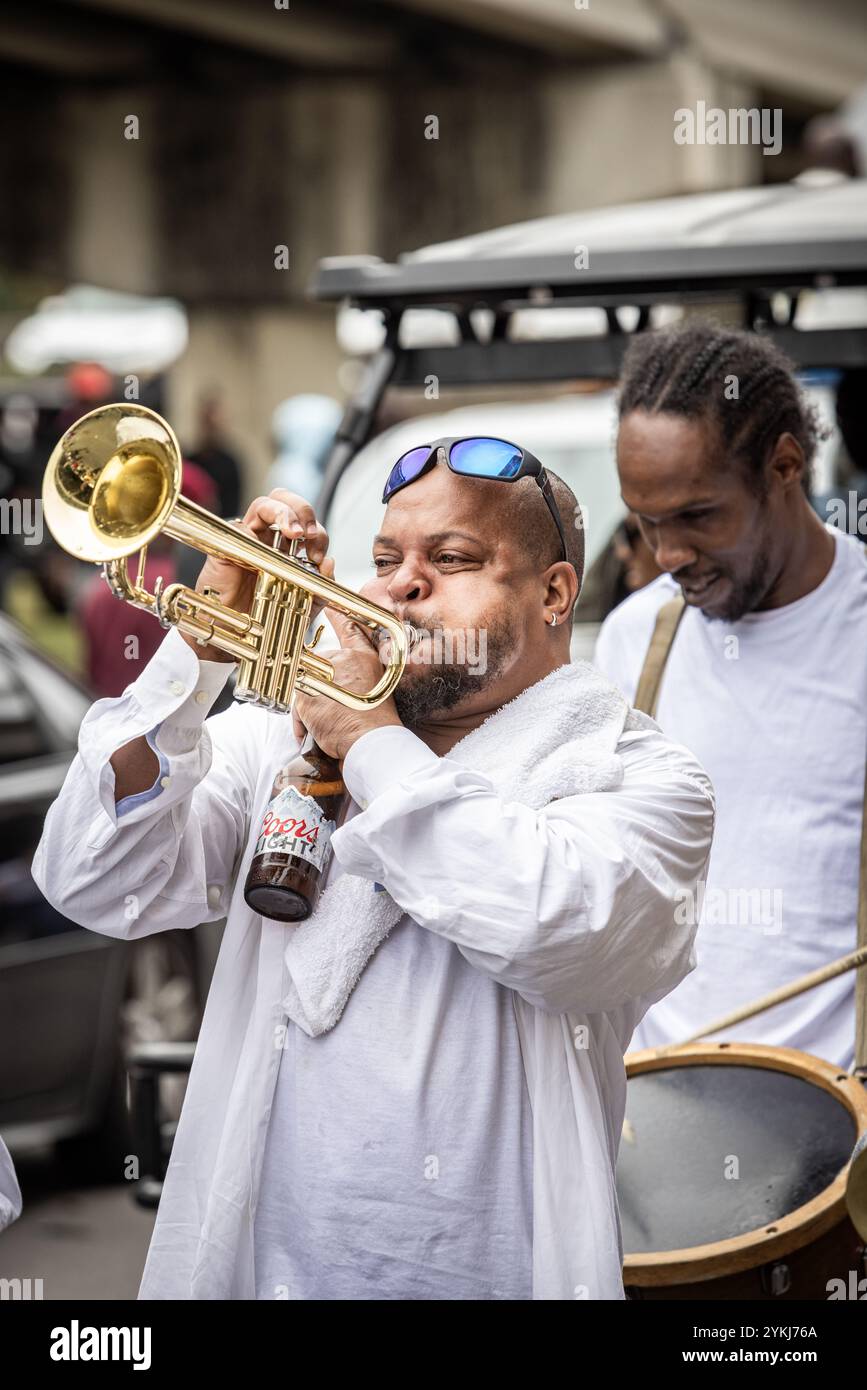 Musicians play in the Second Line parade moving through the streets of ...