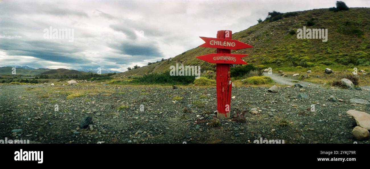Panoramic image of an orange trail sign in the landscape of Torres Del ...