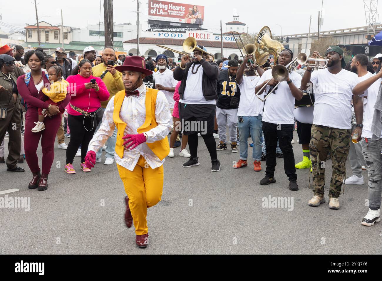 A dancer in the Second Line parade moving through the streets of the ...