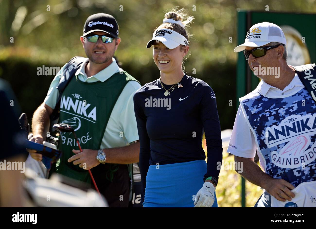 Nelly Korda, center, walks off the first tee with her caddy Jason ...