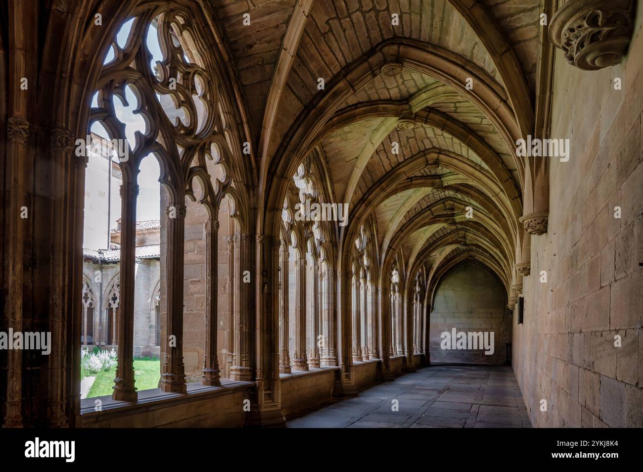 Stone columns and vaulted ceilings of church cloister Stock Photo - Alamy