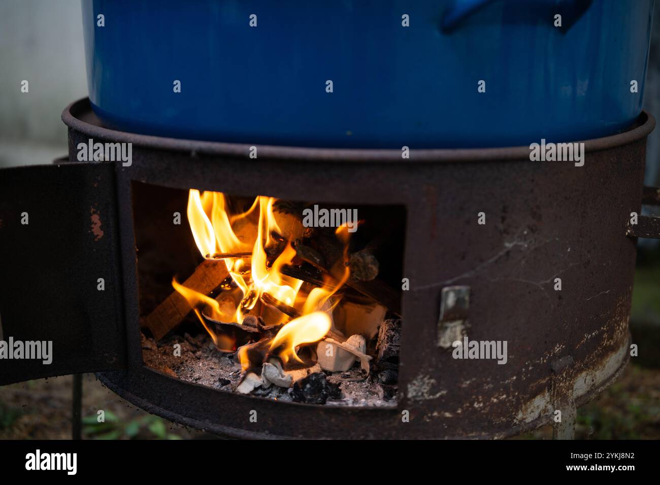 male hands starting fire in a fire pit Stock Photo - Alamy