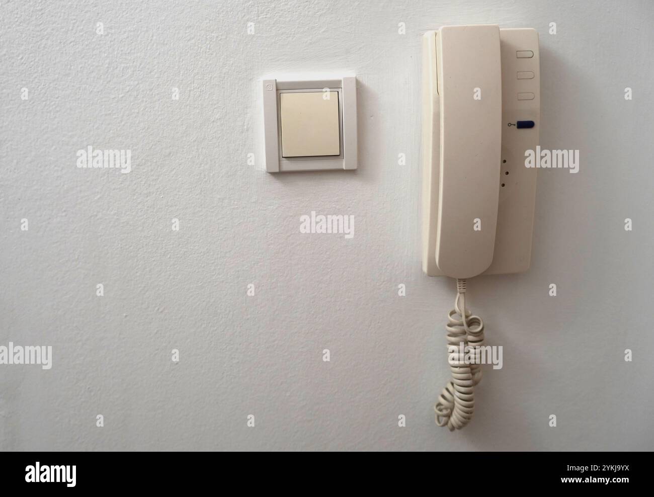 Isolated Plastic Home Phone on White Wall: Call Me Concept Stock Photo ...