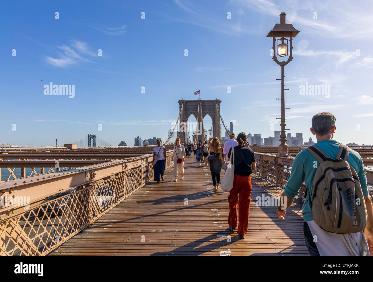 New York, New York - November 6, 2024: ﻿Pedestrians walk over the ...