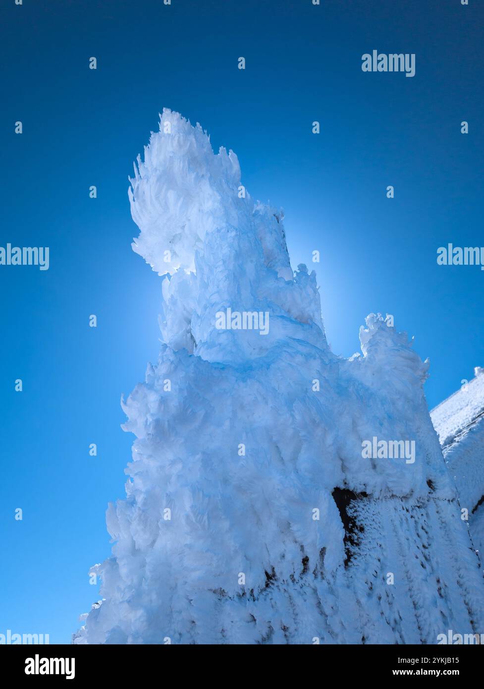 Frozen, ice covered radio antenna on a tall mountain Stock Photo - Alamy