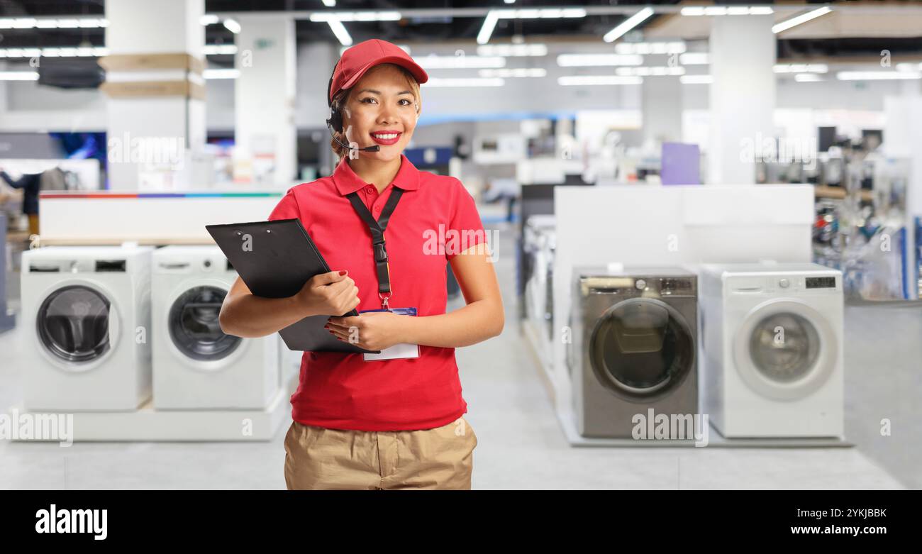Customer service woman with hands free device in a shop with washing ...
