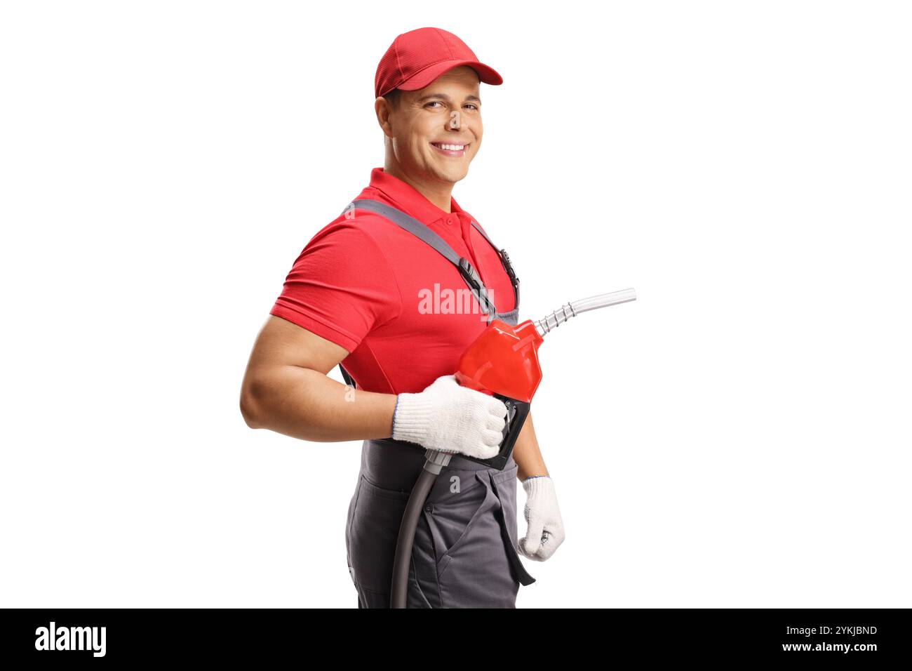 Gas station worker holding a petrol refueling gun and smiling isolated ...