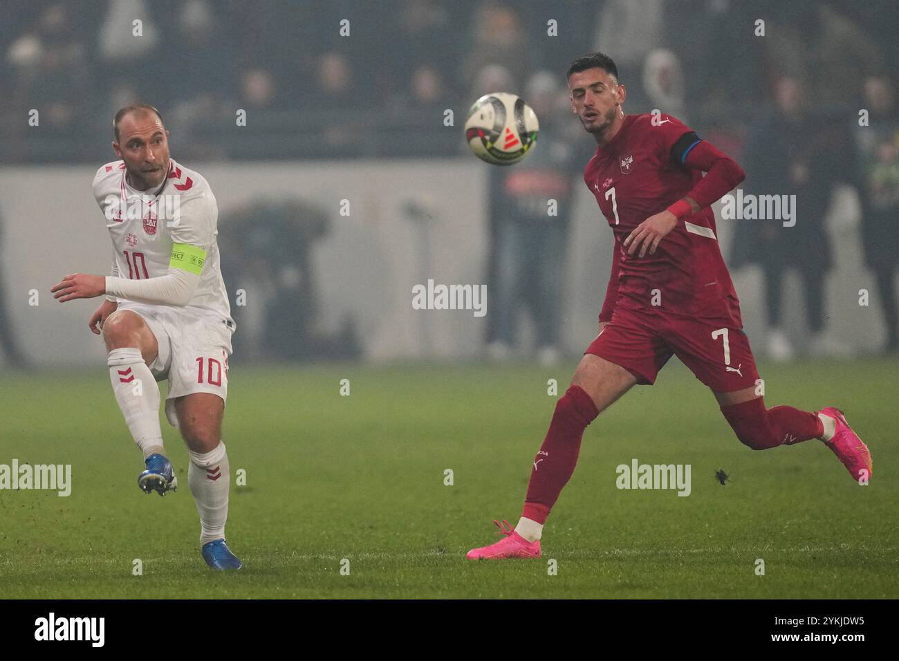 Denmark's Christian Eriksen passes the ball by Serbia's Aleksa Terzic ...