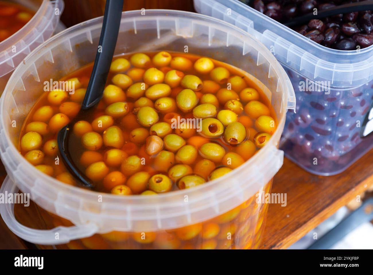 Pile of pitted green olives in bucket Stock Photo - Alamy