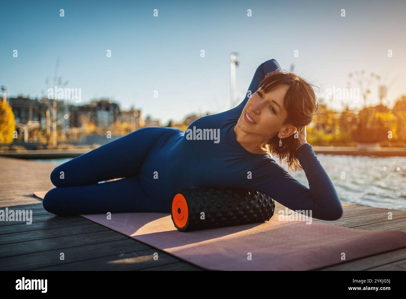 active fitness woman practicing muscular relaxation exercise with ...