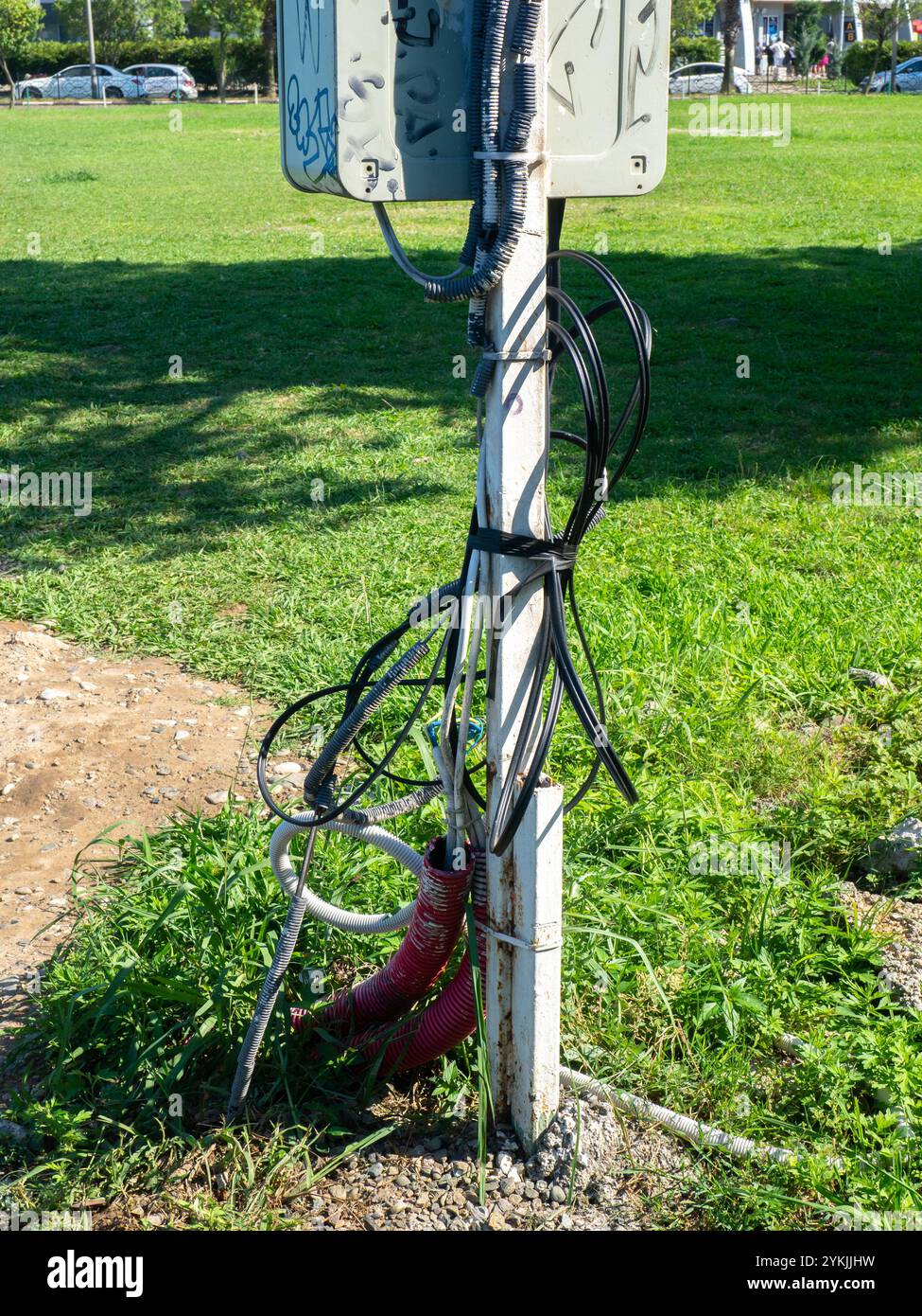 Exposed wiring in a metal pole. Wires sticking out. Pole with wires ...