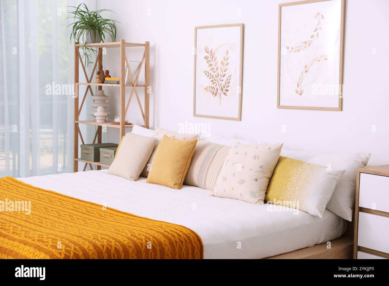 Large bed near window in room. Stylish bedroom interior Stock Photo - Alamy