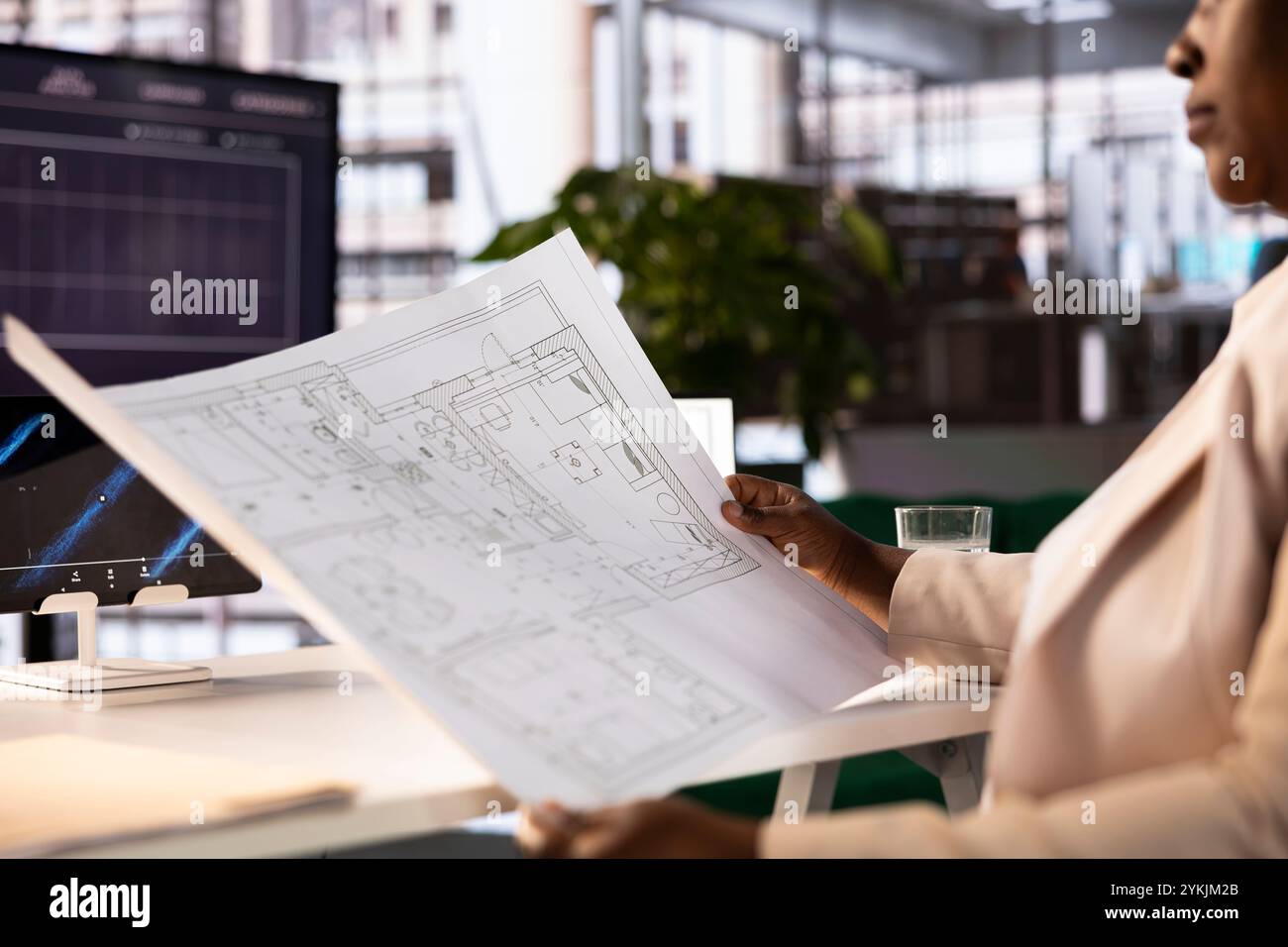 Architect drawing construction blueprint after researching and ...