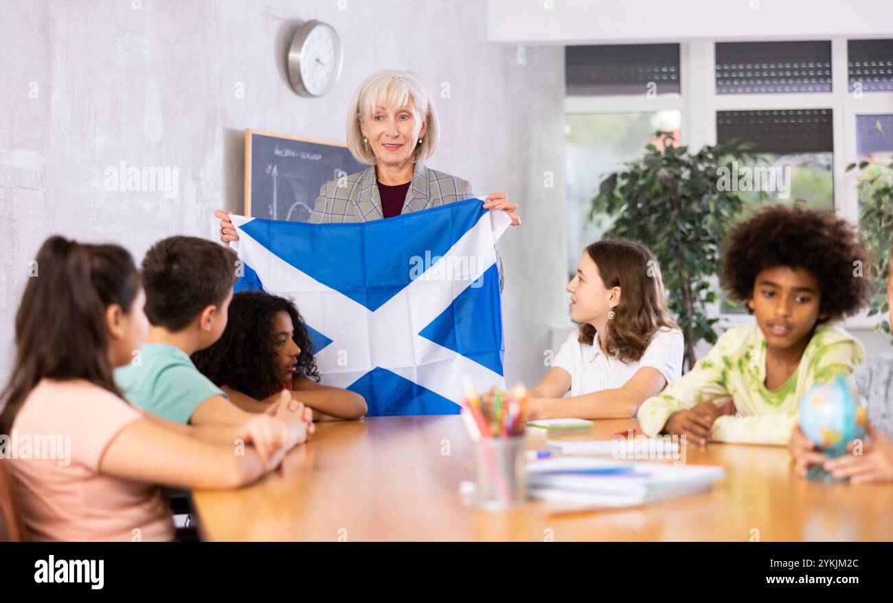 students listen to woman teacher who talks about Scotland Stock Photo ...
