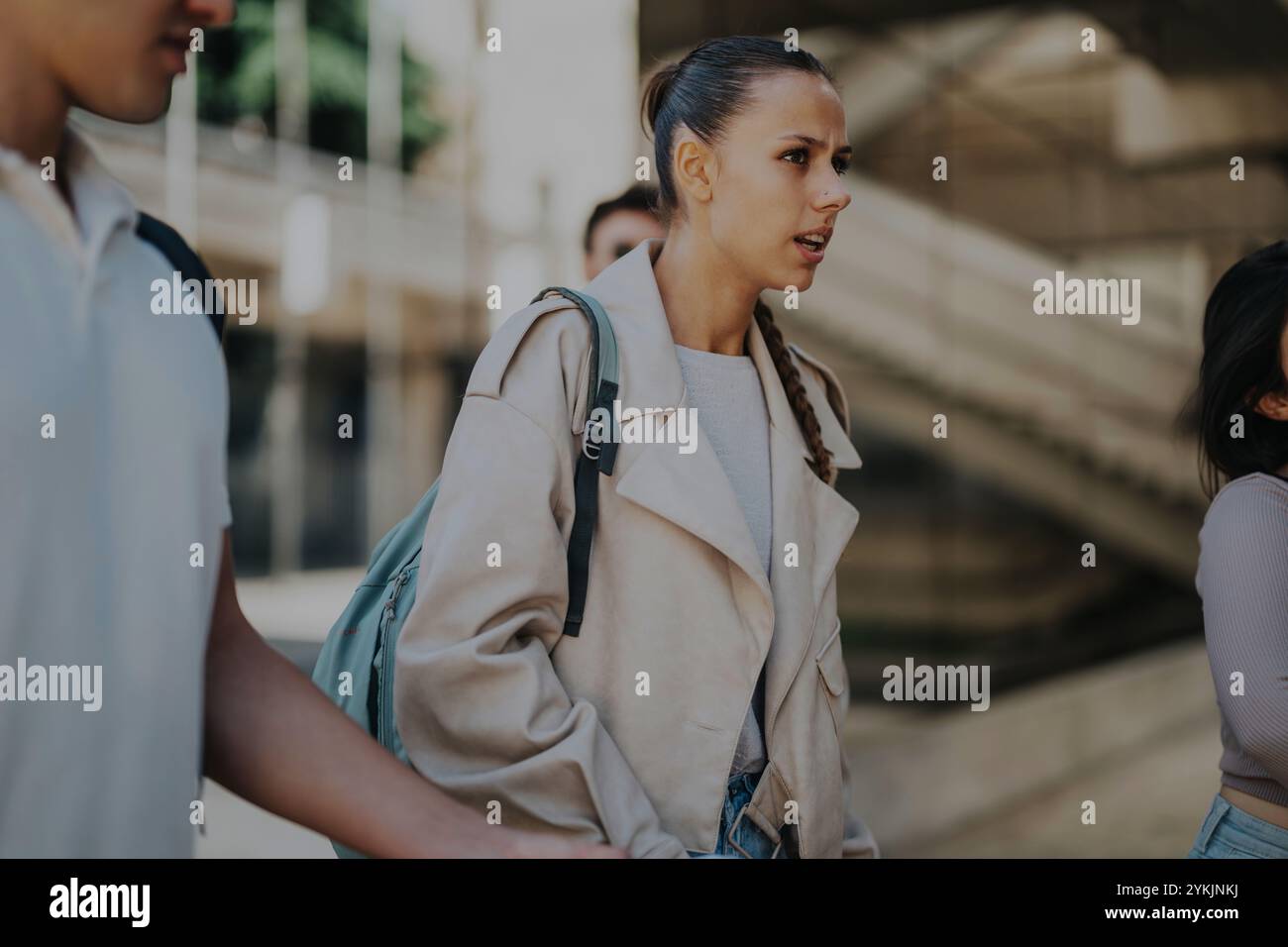 High school students collaborating with professor outdoors Stock Photo ...