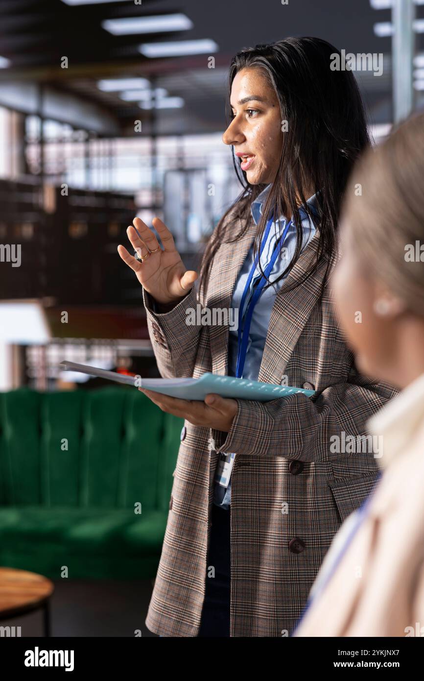 Ambitious indian woman CEO in a meeting with her experts team, planning business strategies to ...