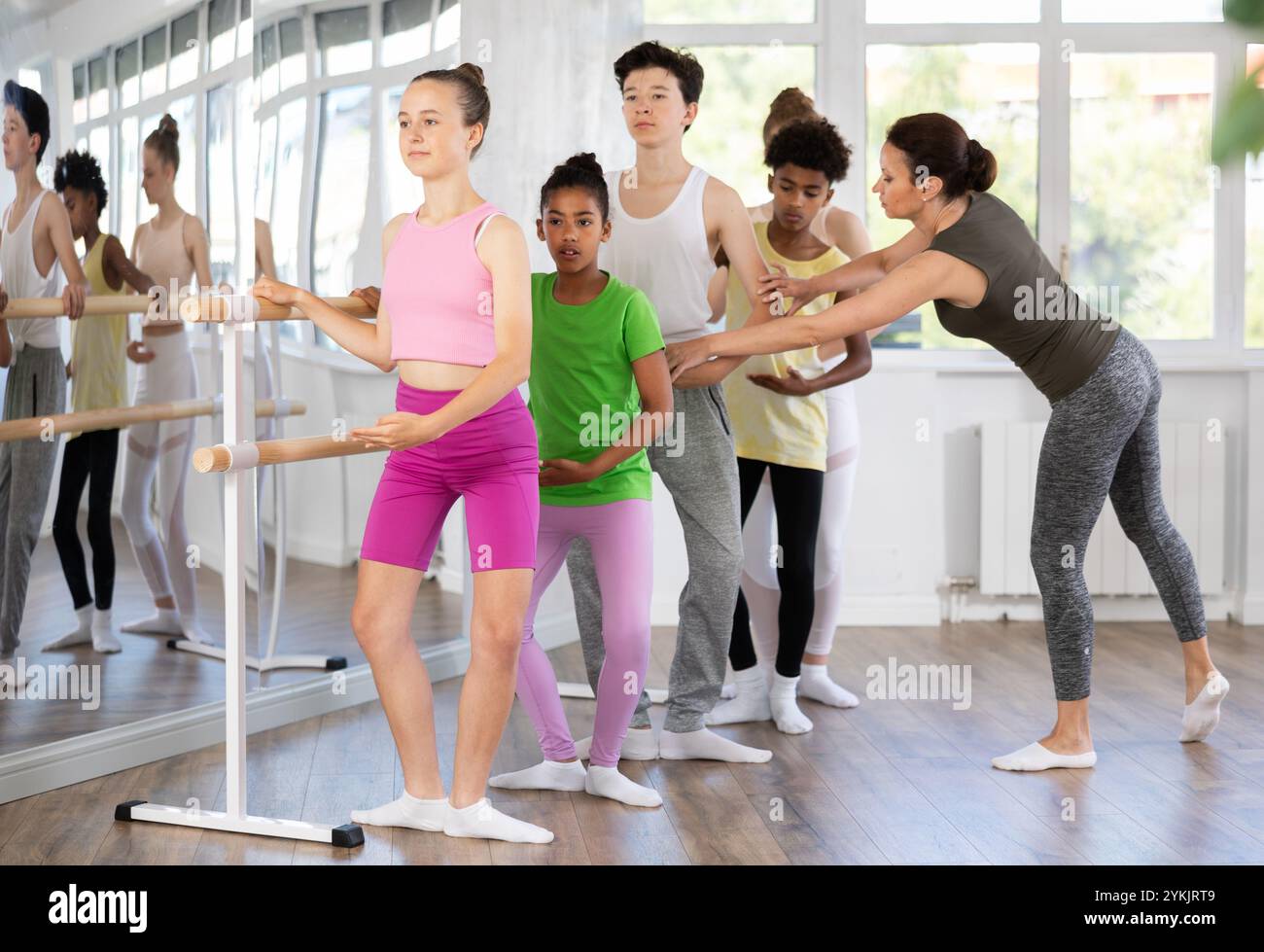 Woman teacher corrects movement hi-res stock photography and images - Alamy