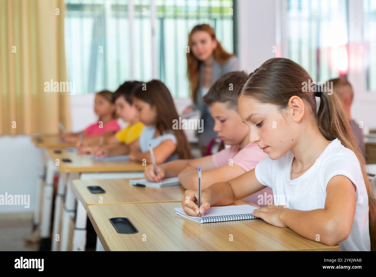 Pupils in classroom Stock Photo - Alamy