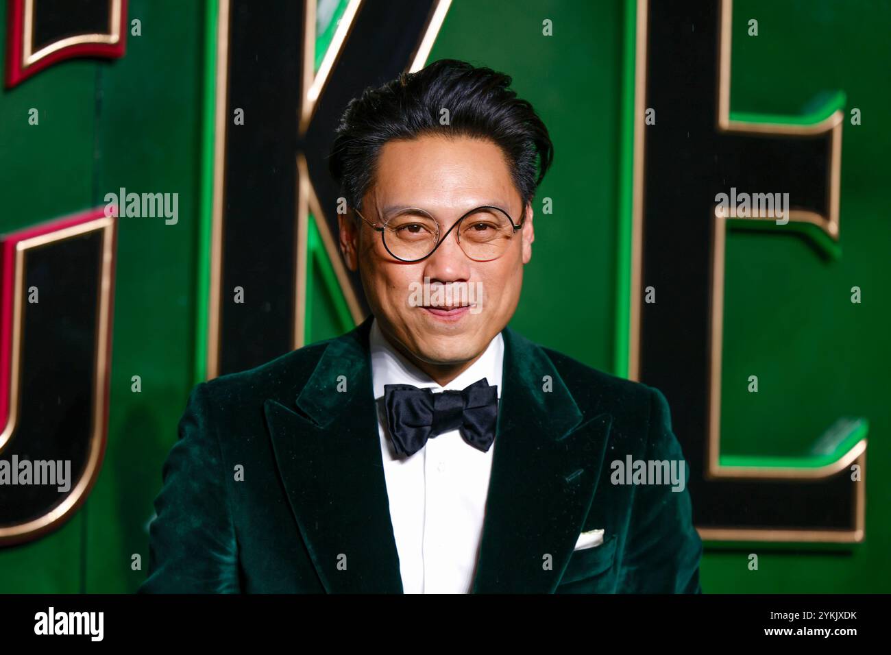 Director Jon M. Chu poses for photographers upon arrival at the premiere of the film 'Wicked' on ...