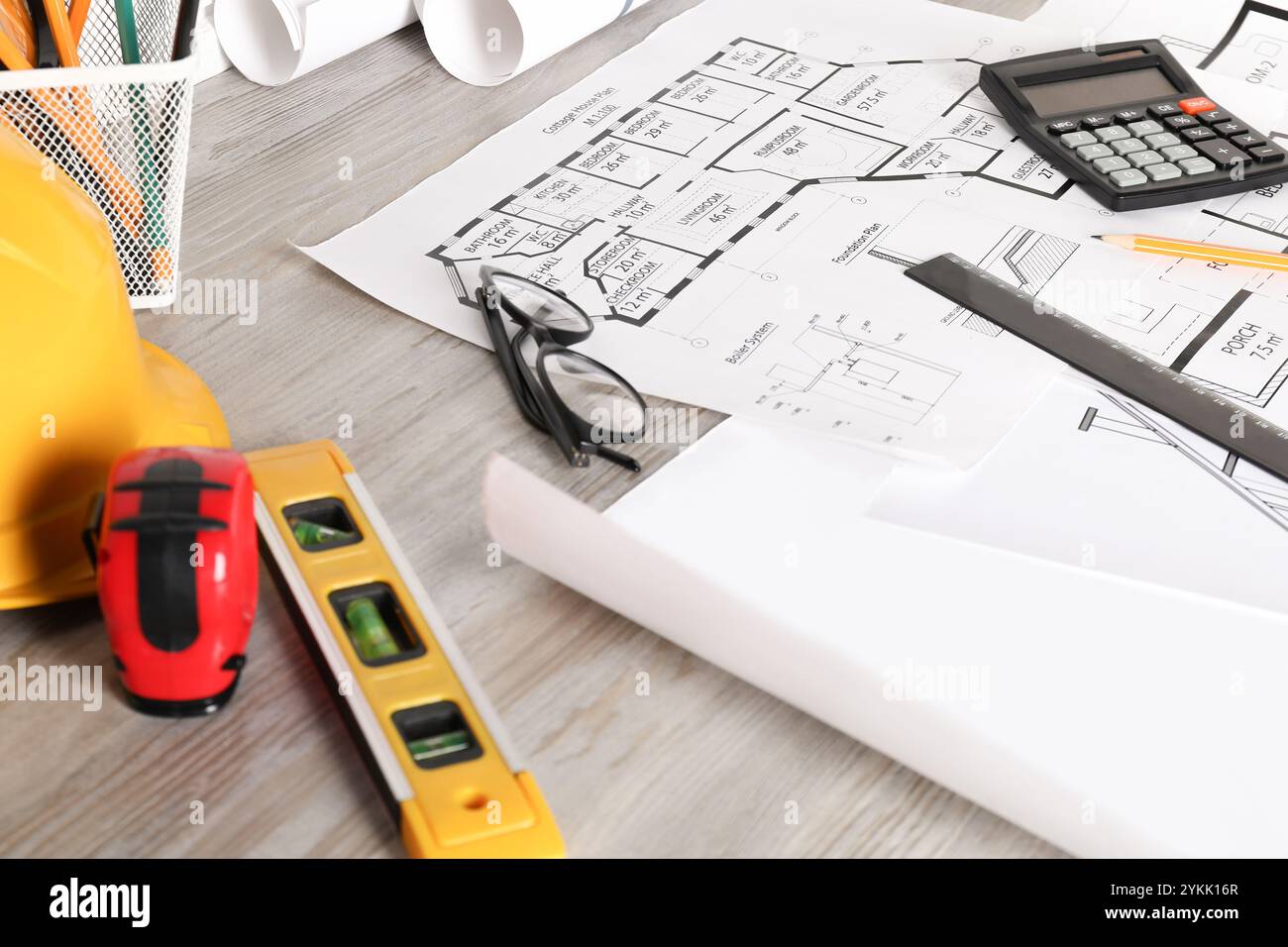 Different engineering drawings and tools on wooden table Stock Photo ...