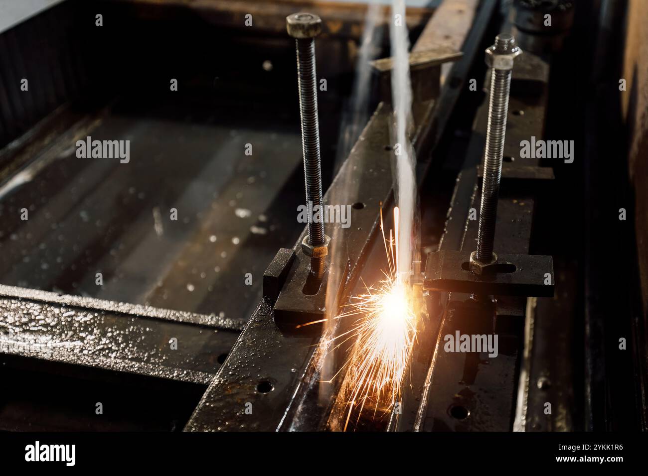Working plasma cutter with water cooling Stock Photo - Alamy