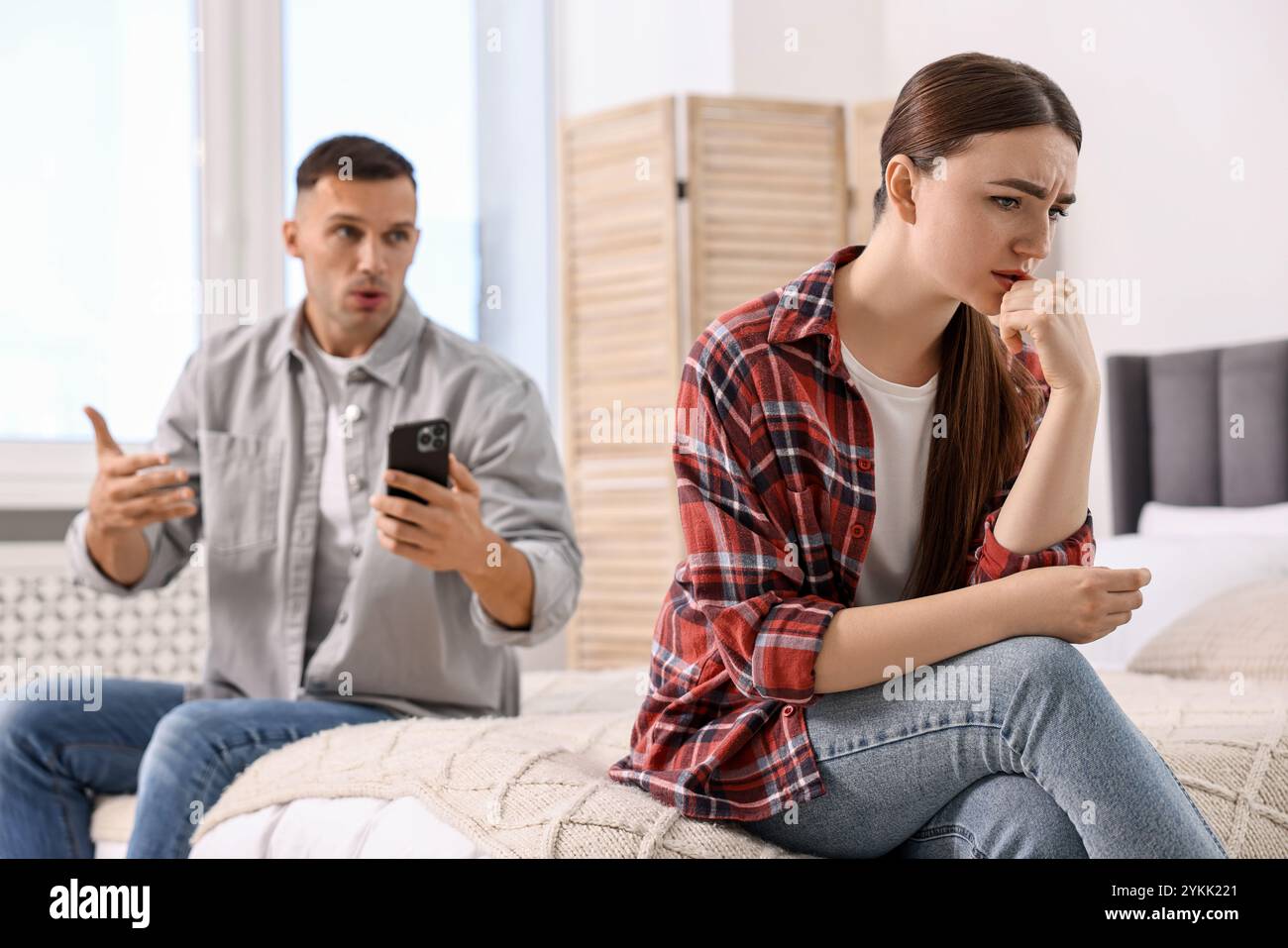Upset woman ignoring her husband at home, selective focus Stock Photo ...