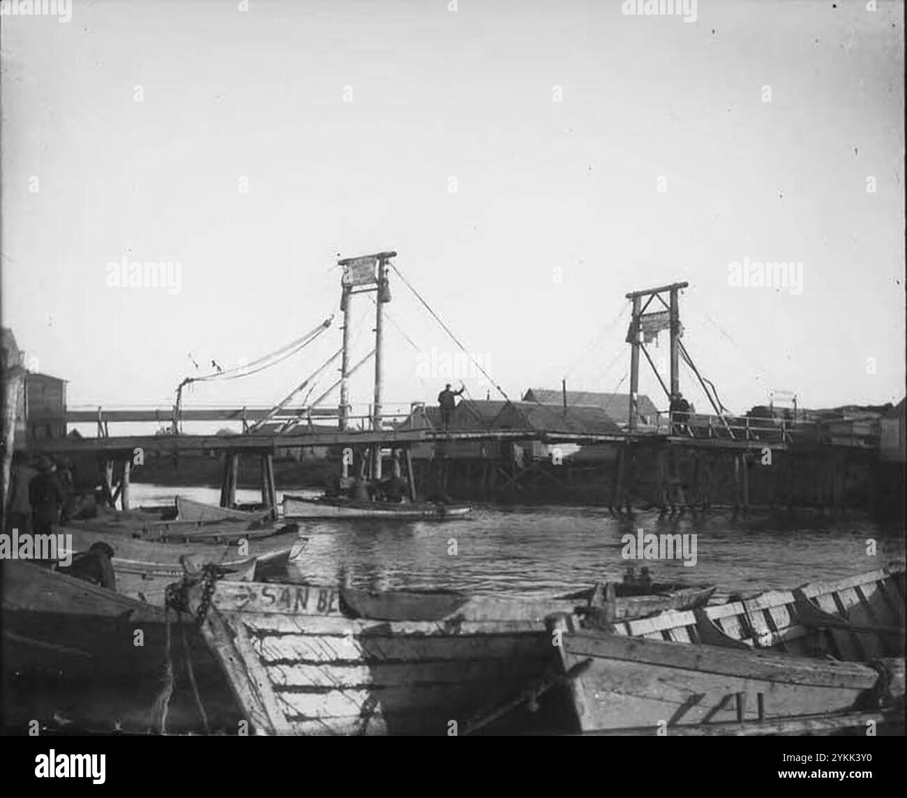 Boats in front of Snake River Bridge, Nome, Alaska, during the Gold ...