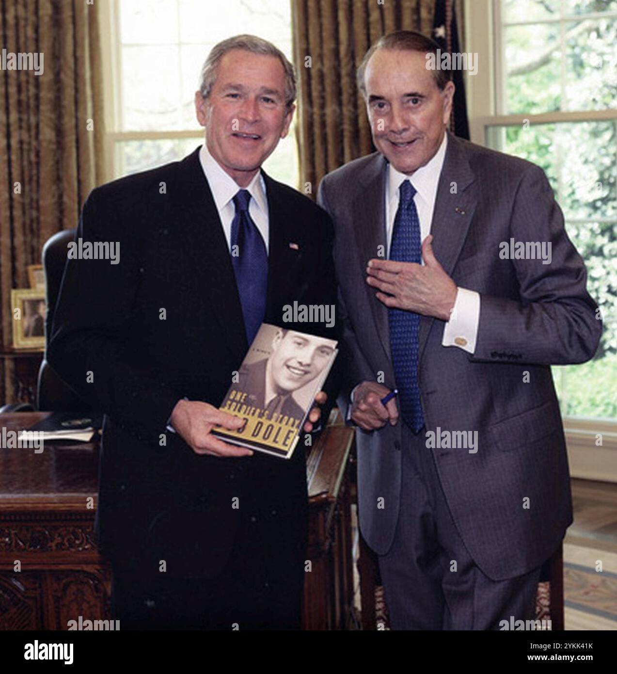 Bob Dole presenting President George W. Bush with signed book, 2005 ...