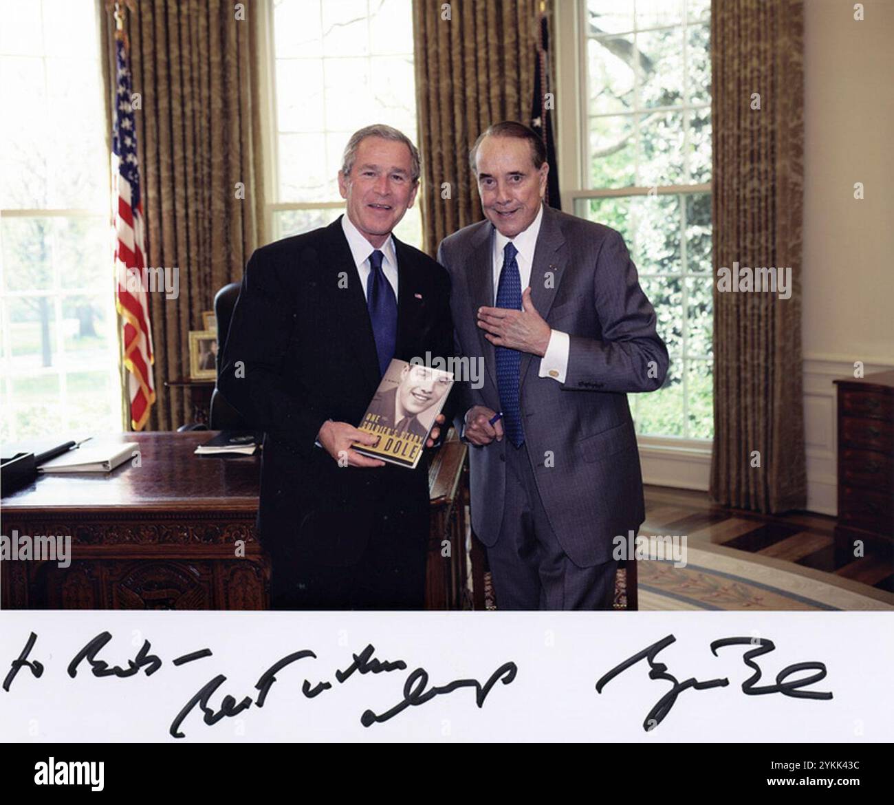 Bob Dole presenting President George W. Bush with signed book, 2005 ...